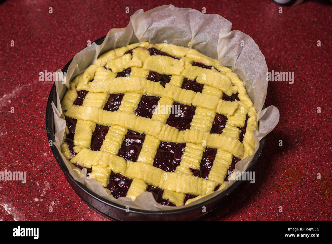 Unbaked american pie with cherry Stock Photo - Alamy