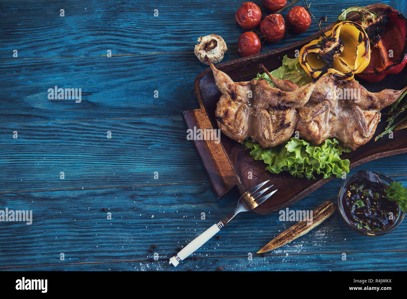 Grilled quail meat Stock Photo - Alamy