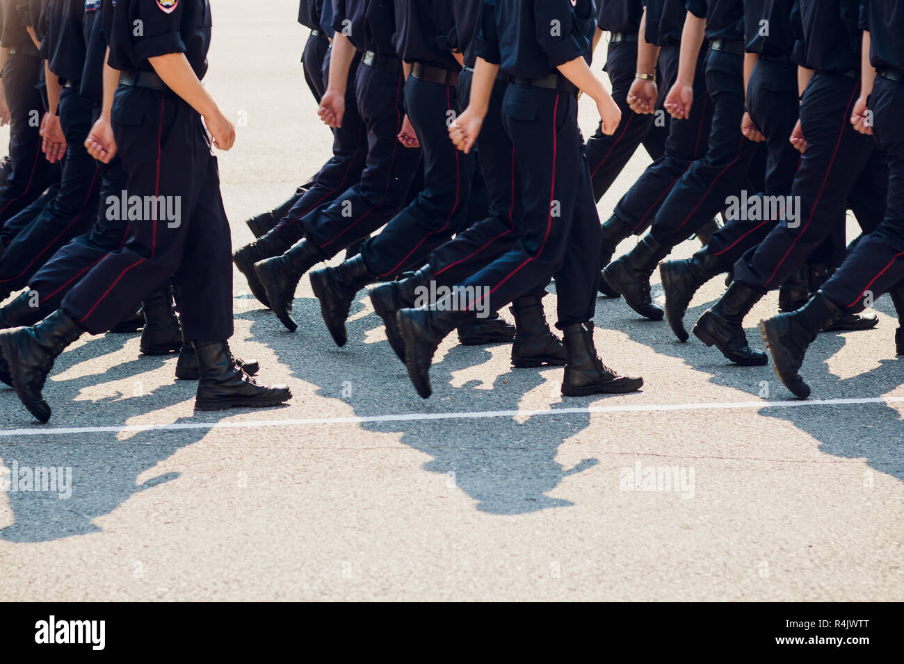 the police are marching. legs. shoes in line Stock Photo - Alamy