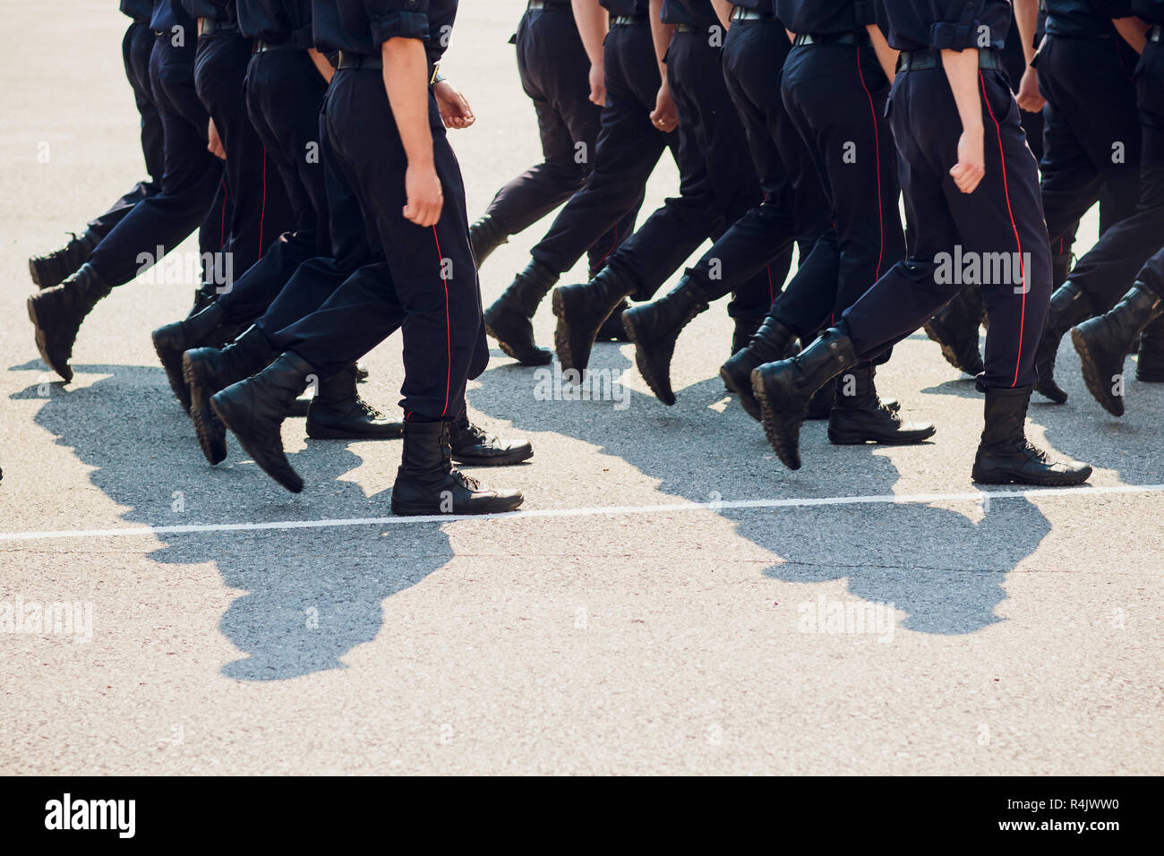 the police are marching. legs. shoes in line Stock Photo - Alamy