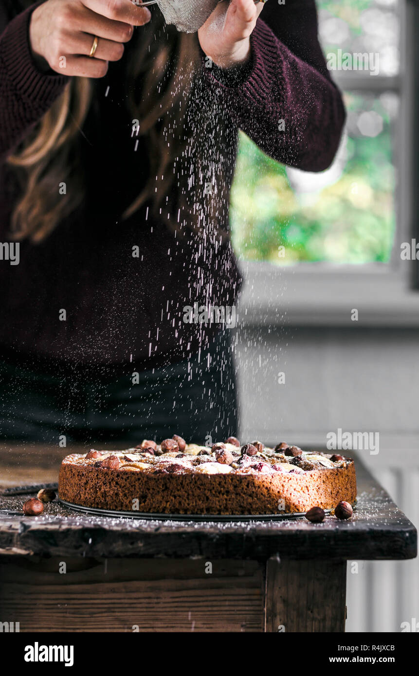 Woman dusting hands hi-res stock photography and images - Alamy