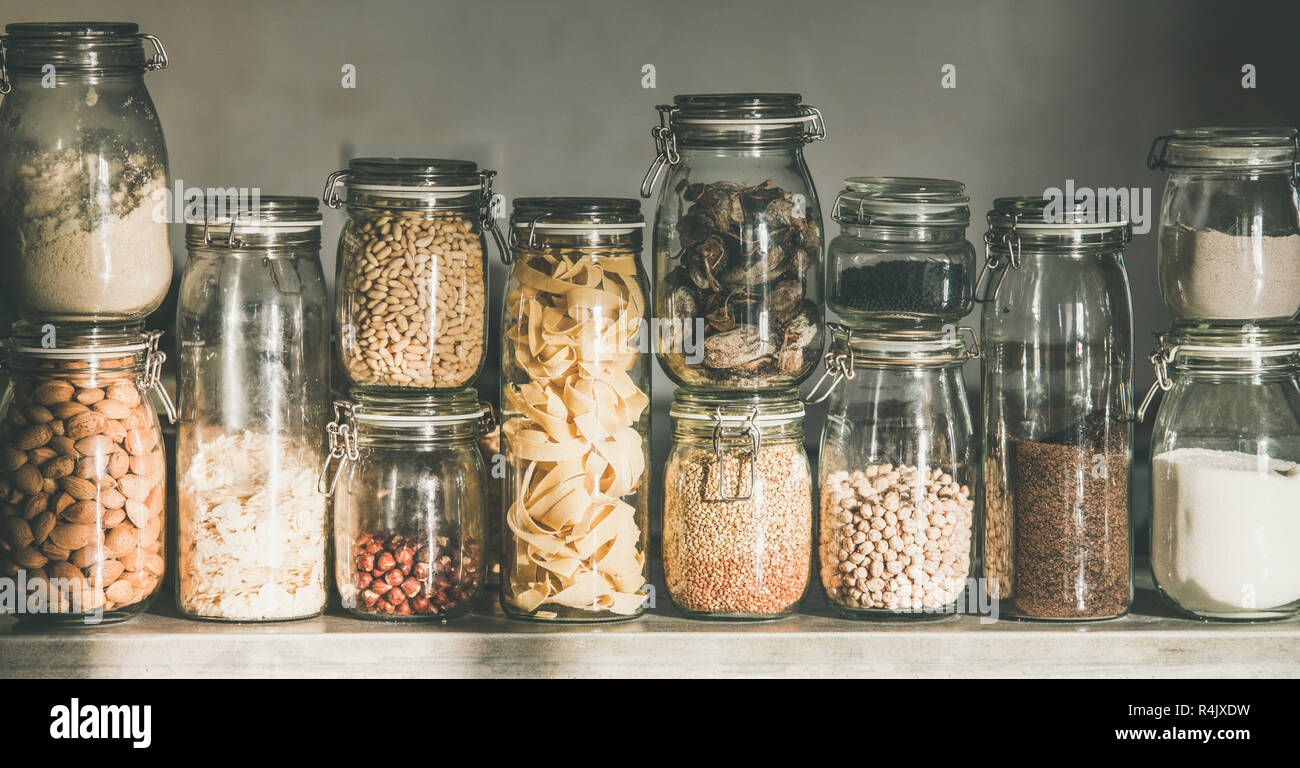 Rustic kitchen food storage arrangement. Grains, cereals, nuts, dry ...