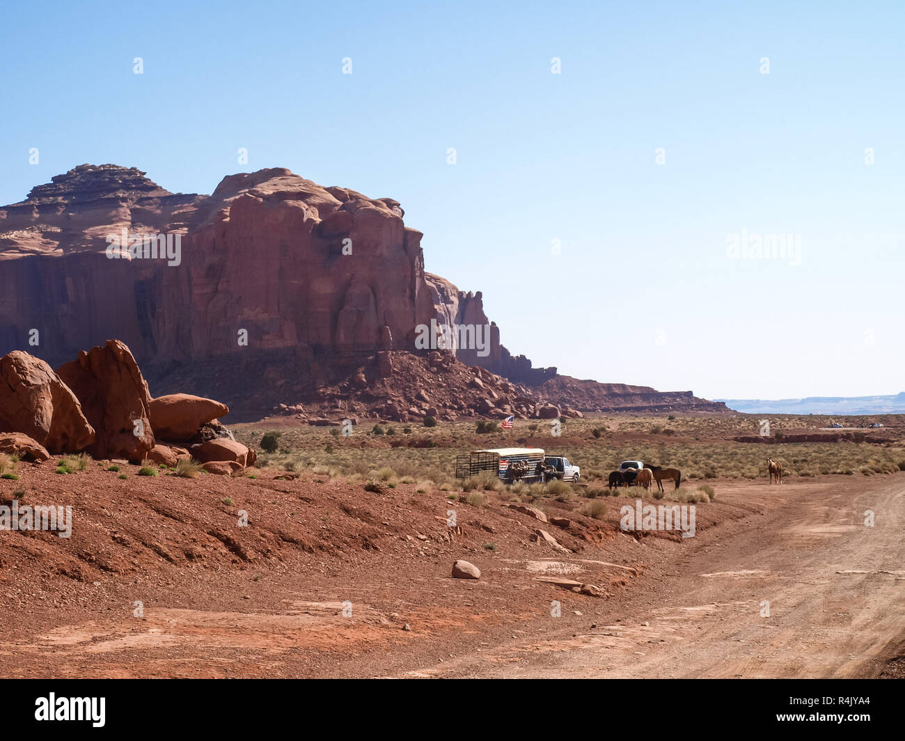 Cars on the background Monument Valley Stock Photo - Alamy