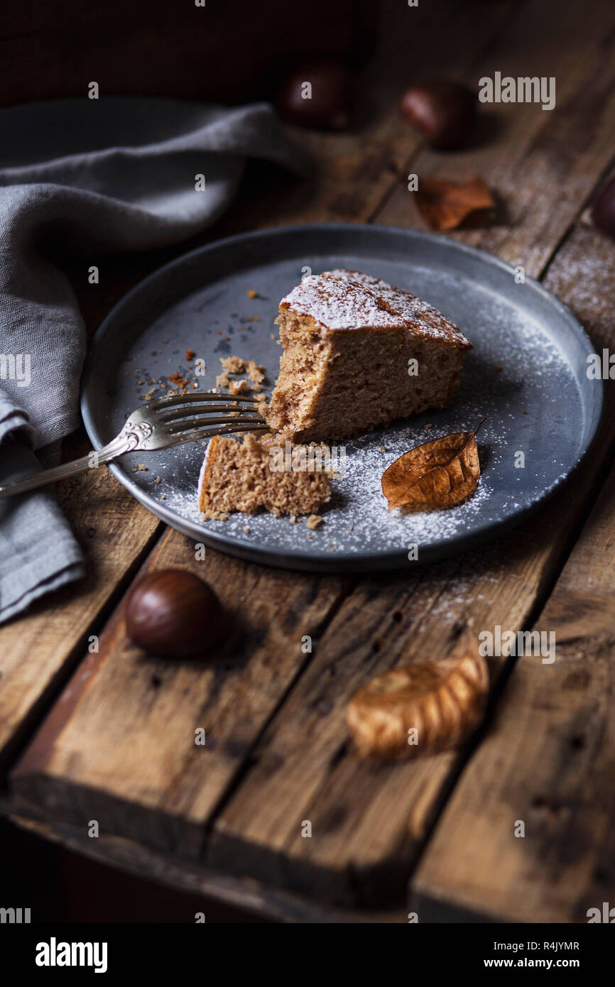A slice of chestnut cake. Autumn mood Stock Photo - Alamy