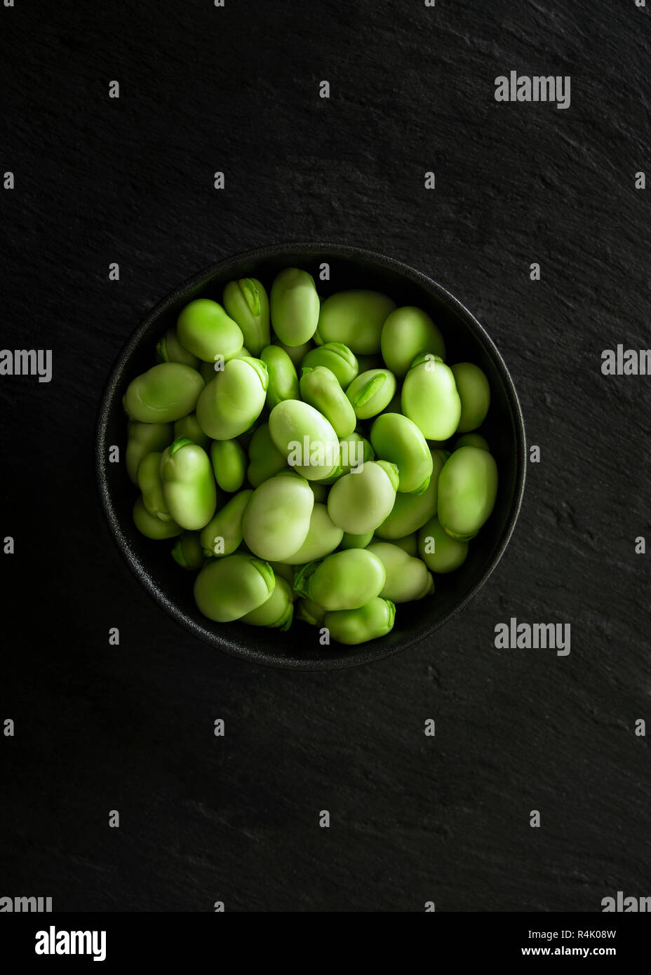 Raw fava beans in a bowl Stock Photo - Alamy