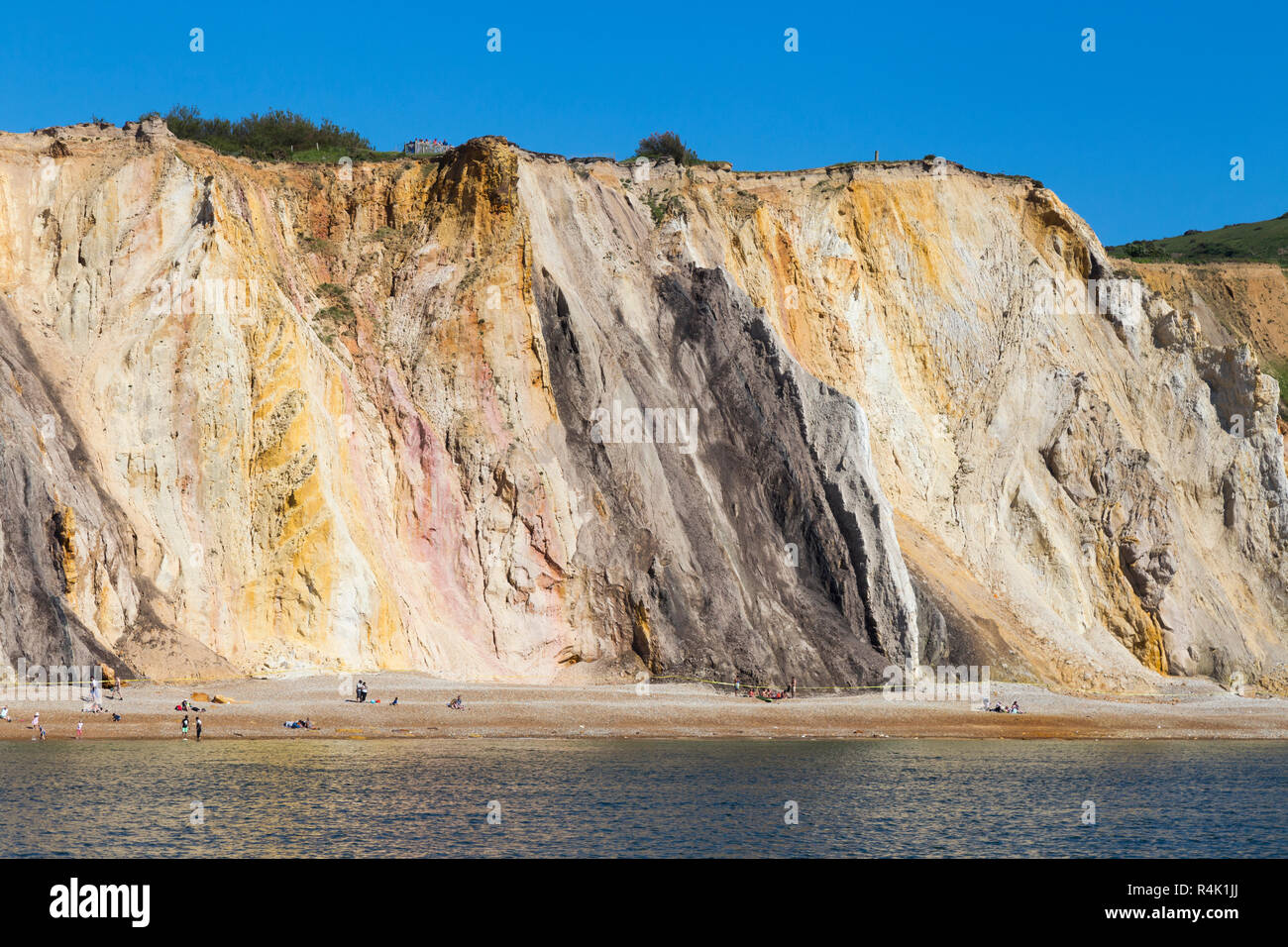 Famous multi coloured layered sands of the sandy cliffs of Alum Bay ...