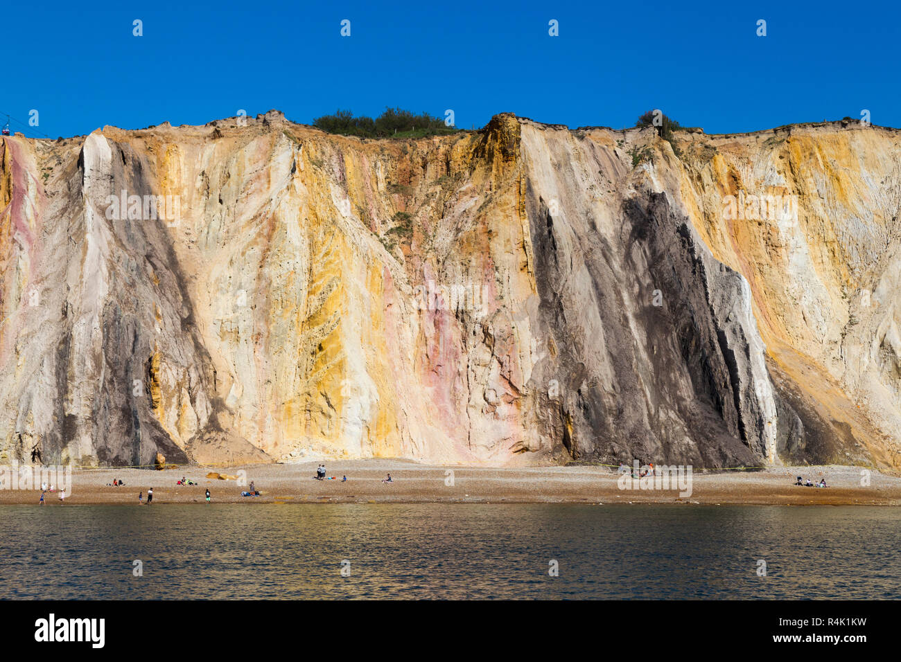 Famous multi coloured layered sands of the sandy cliffs of Alum Bay ...