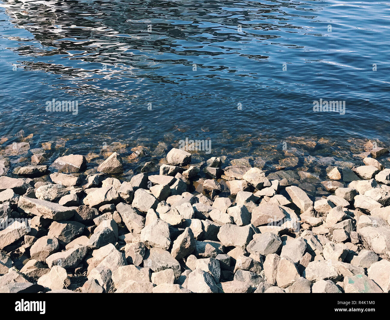 Beach of river with cool stones Stock Photo - Alamy