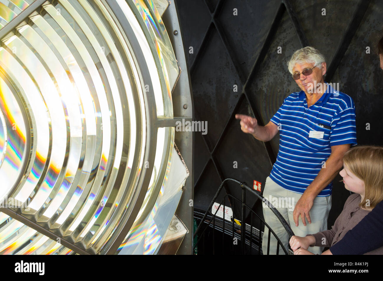 Volunteer guide shows child visitor the specially shaped prisms which ...