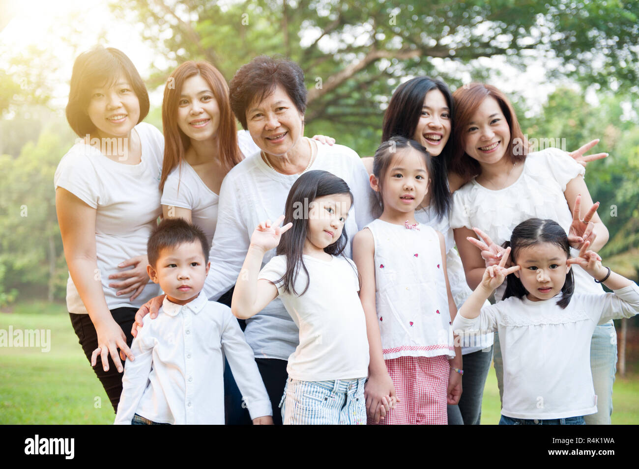 Group of Asian multi generations family outdoors Stock Photo - Alamy