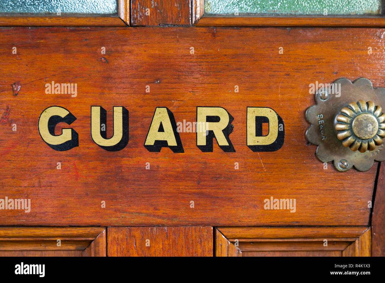 The word Guard painted in gold letters / lettering on the door of the ...