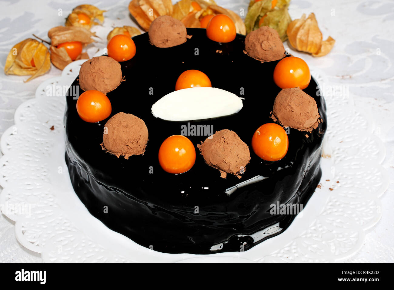 demi glace chocolate truffle physalis cake Stock Photo - Alamy