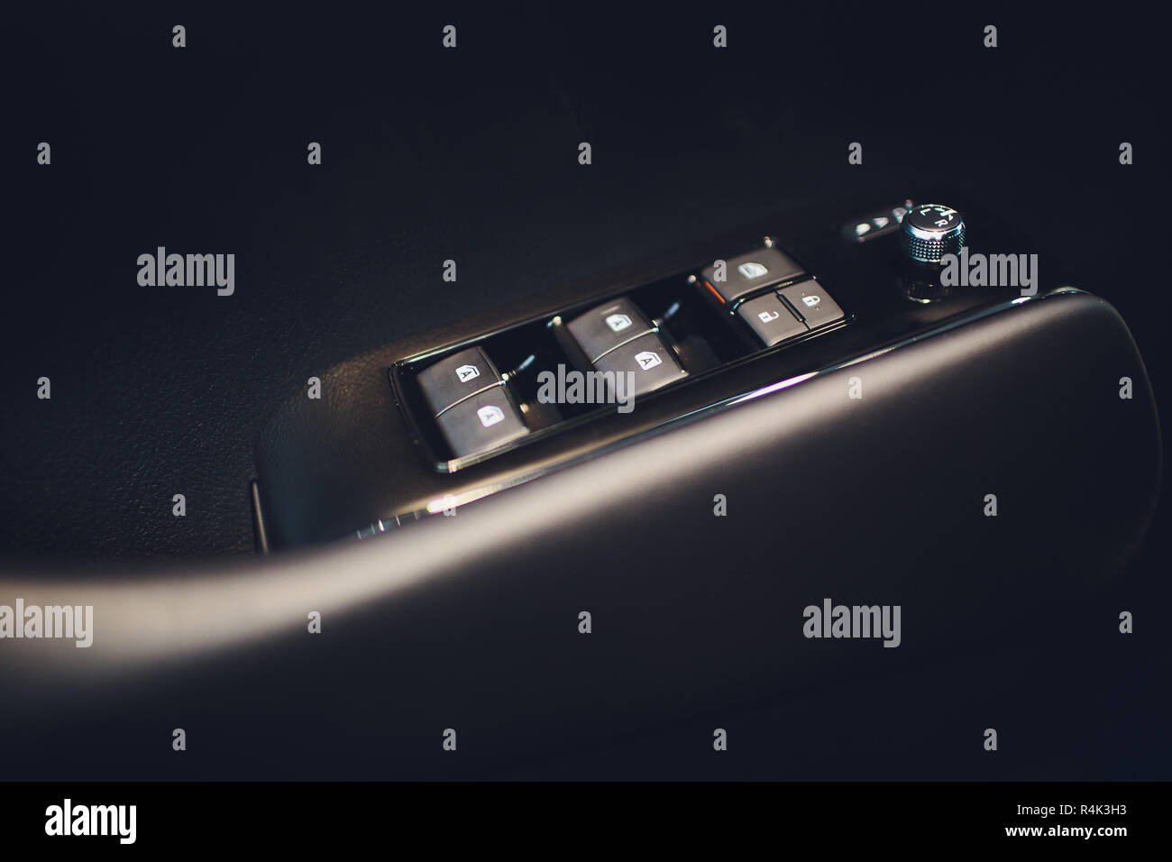 car leather interior details of door handle with windows controls and ...