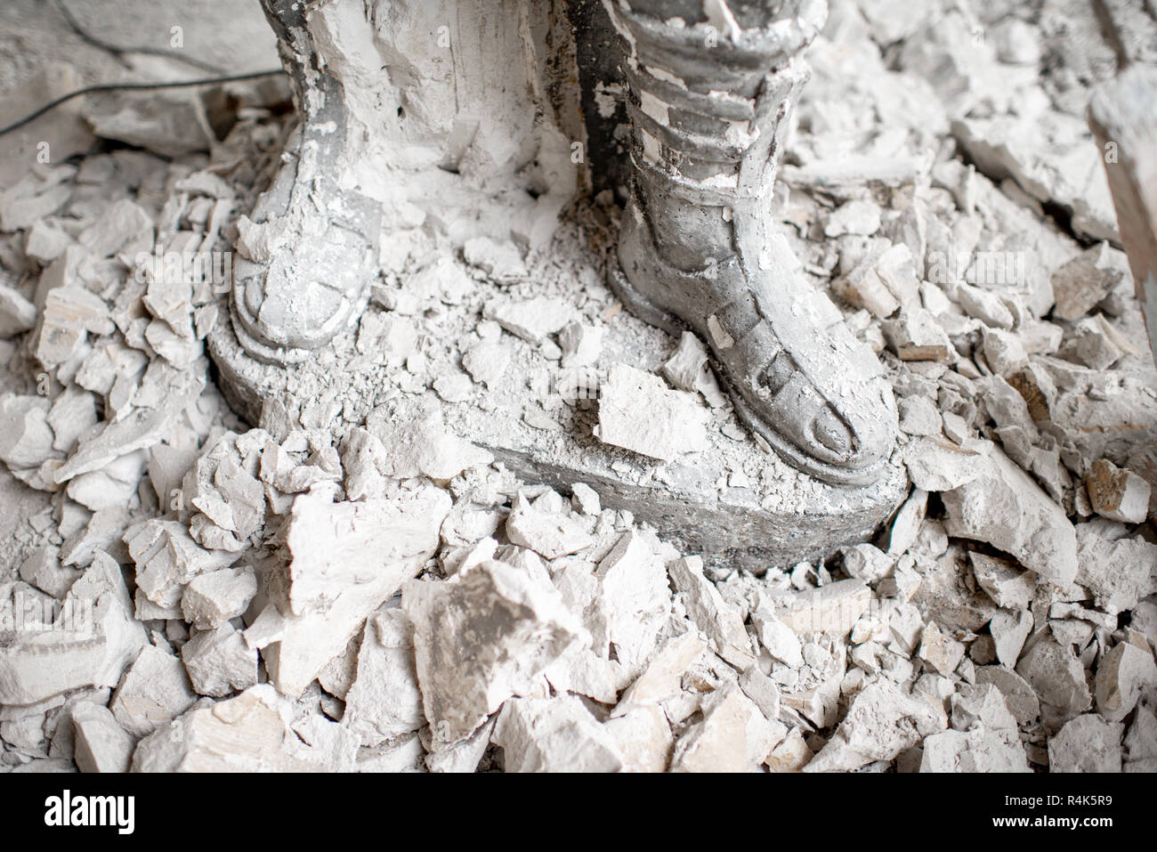 Sculpture's legs with stone pieces on the floor in the studio Stock ...
