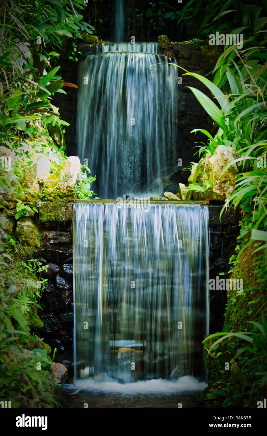 Serene Tropical Waterfall Stock Photo - Alamy