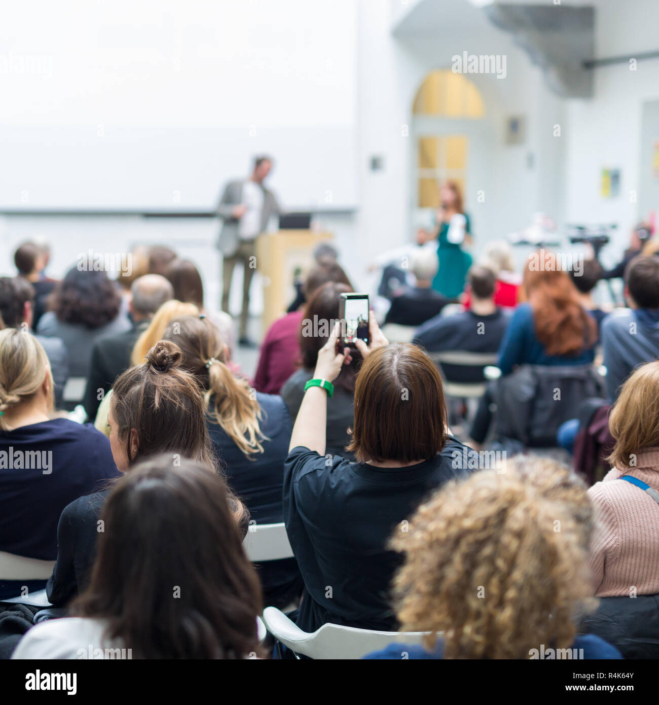 Man giving presentation in lecture hall at university Stock Photo - Alamy