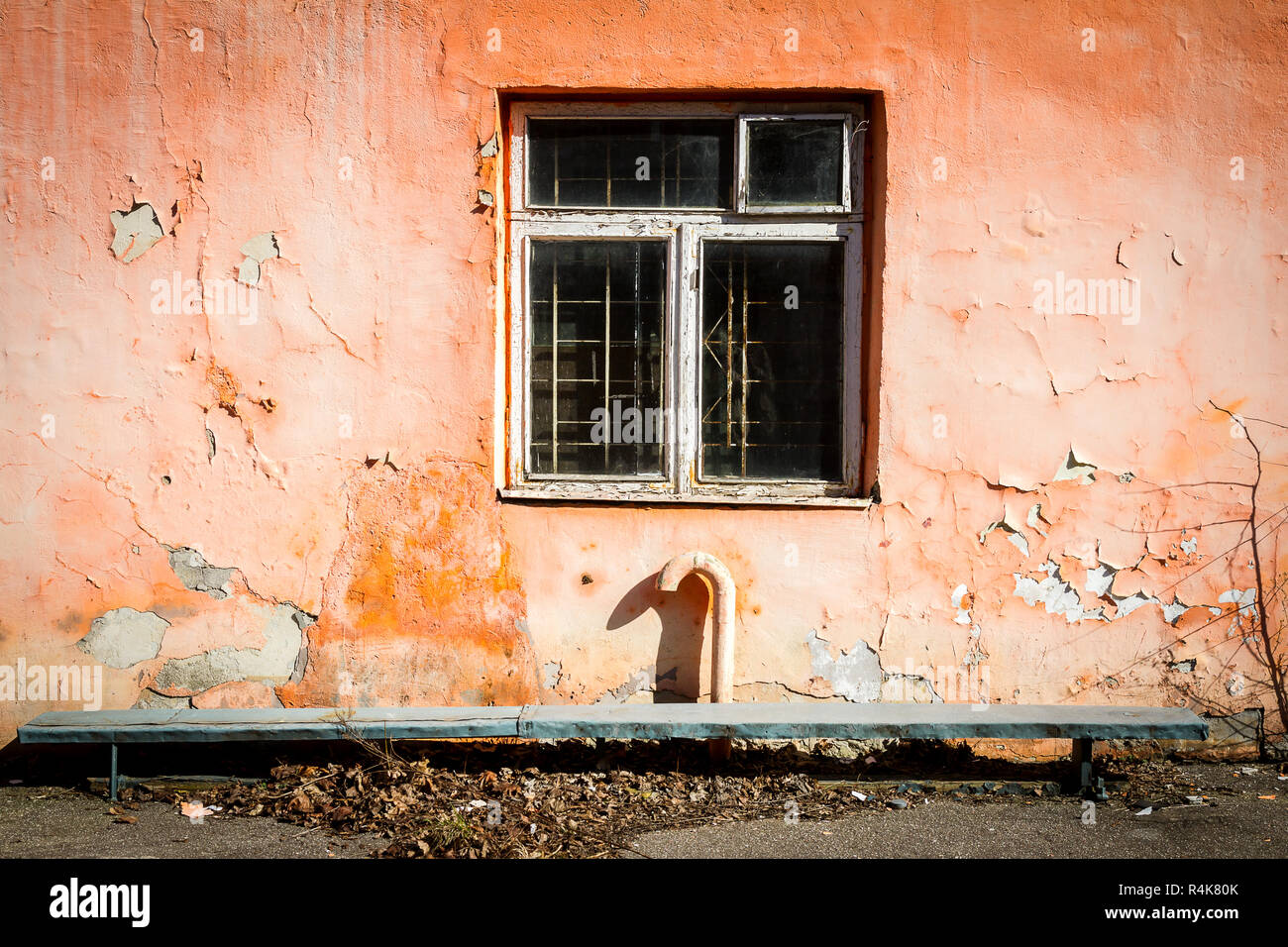 Old orange wall with a window. Abandoned building Stock Photo - Alamy