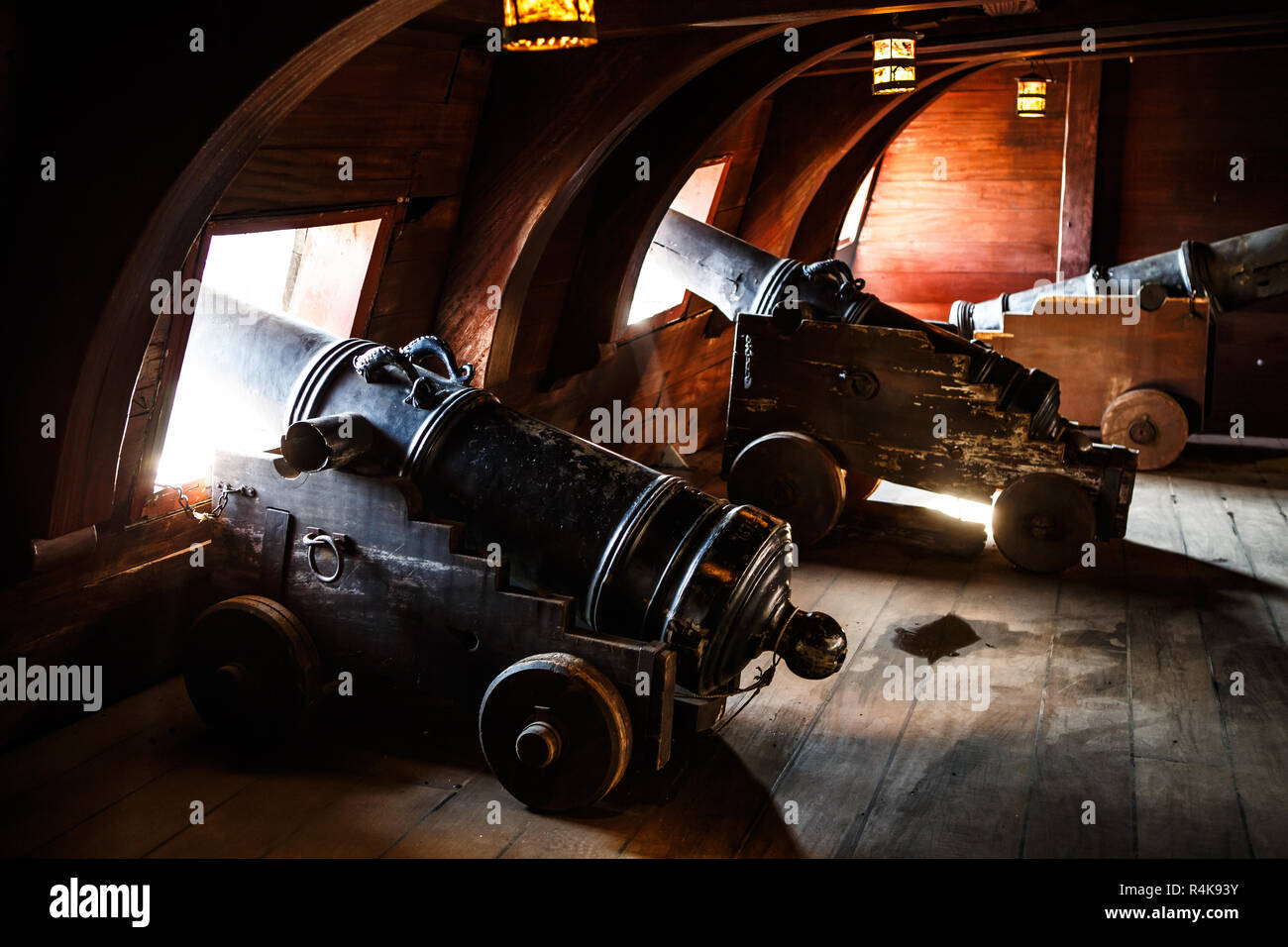 Ancient military galleon ship with round shot cannons. Iron cannon gun ...