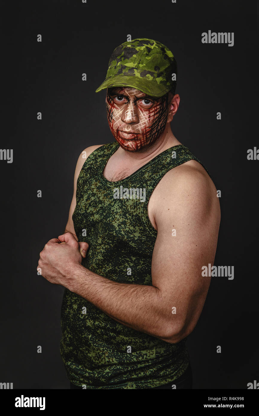 Military Style Camouflage on the Soldier's Face Stock Photo - Alamy
