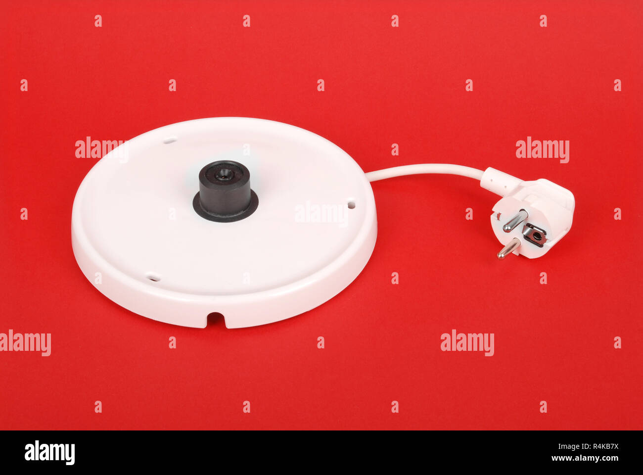 Base unit for electrical kettle isolated on the red background Stock ...
