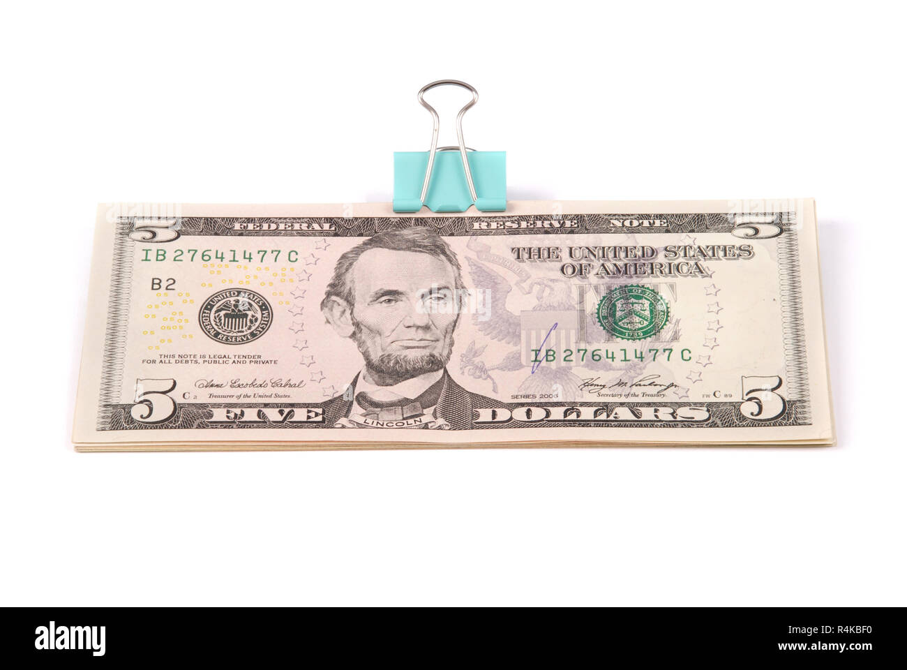 Wads of money five dollars isolated on white background Stock Photo - Alamy
