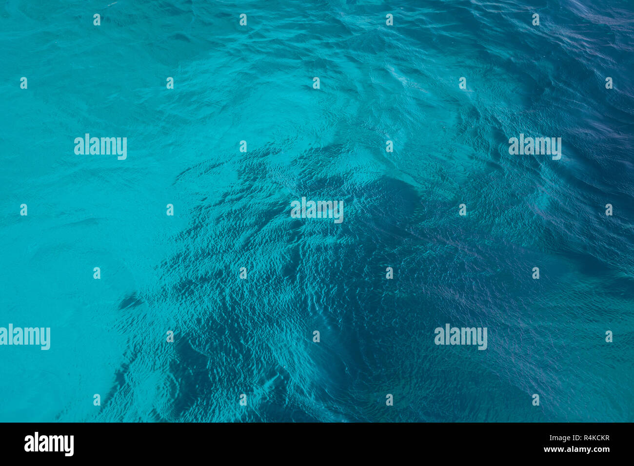 Clear turquoise sea water surface background Stock Photo - Alamy