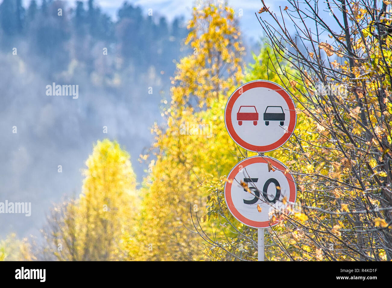 View of two road signs in autumn mountains Stock Photo - Alamy