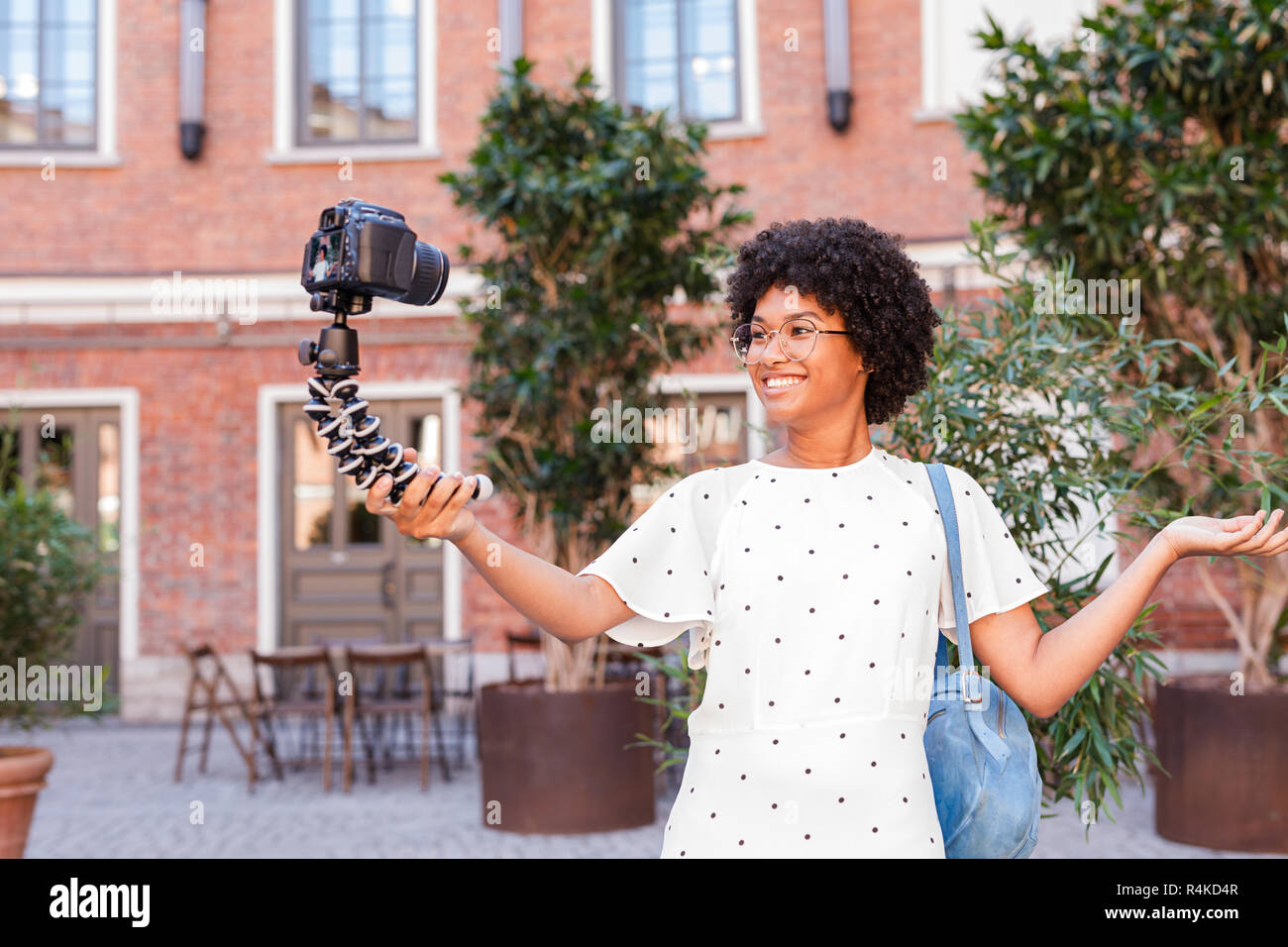 Happy female influencer recording video hi-res stock photography and ...