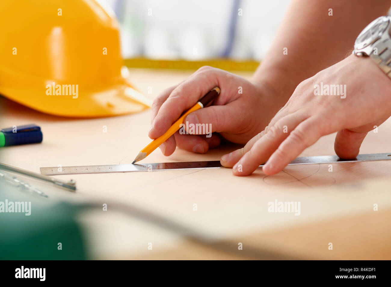 Arms of worker making structure plan on scaled paper closeup Stock ...