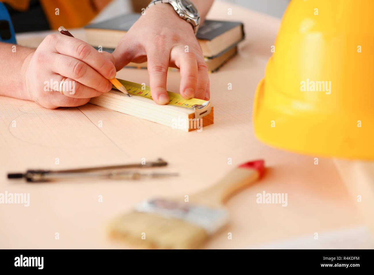 Arms of worker making structure plan on scaled paper closeup Stock ...