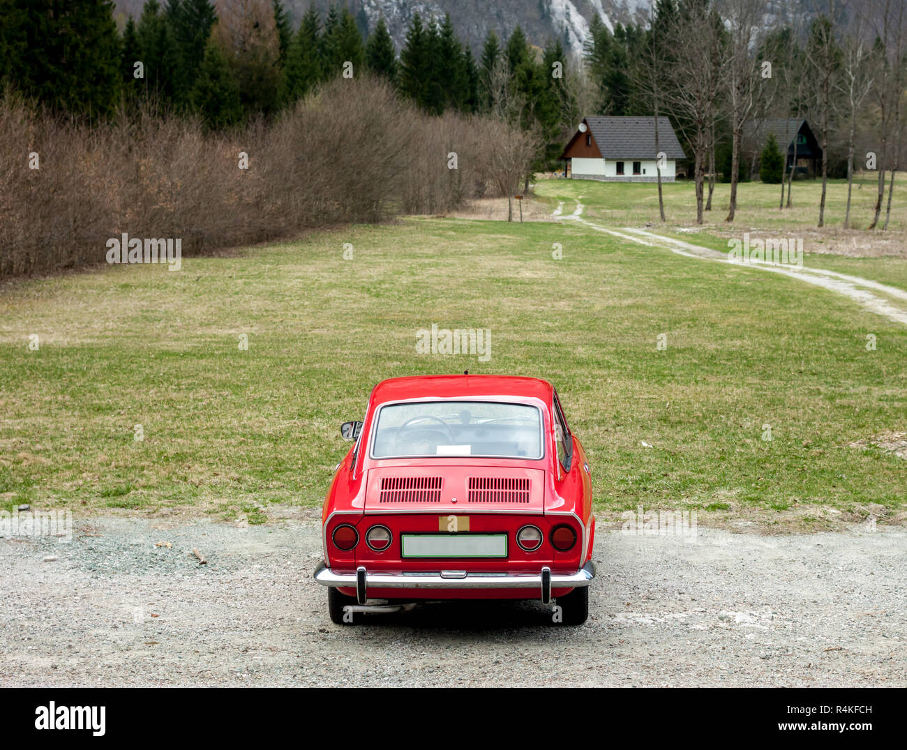 red retro car in the nature Stock Photo - Alamy