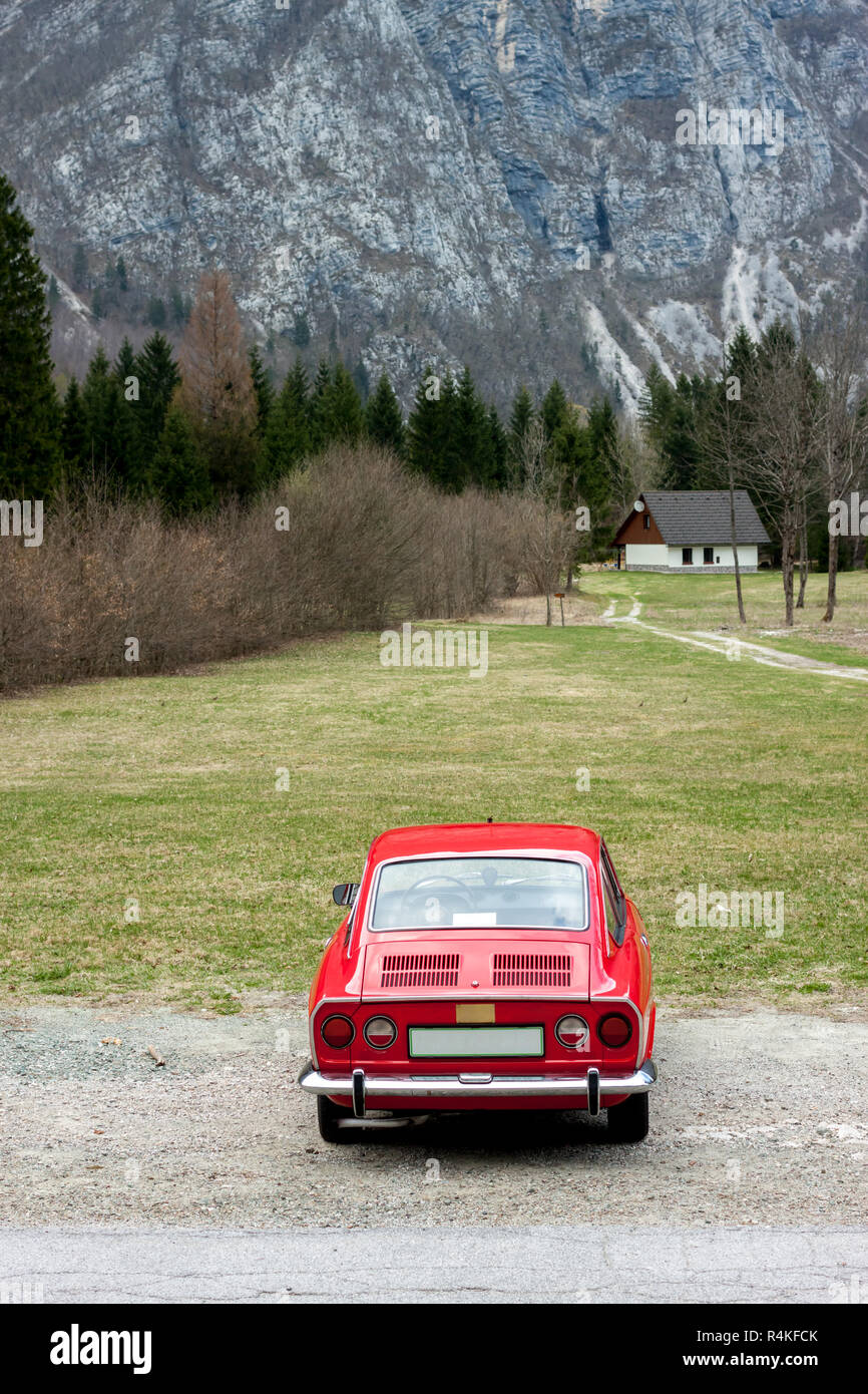 red retro car in the nature Stock Photo - Alamy