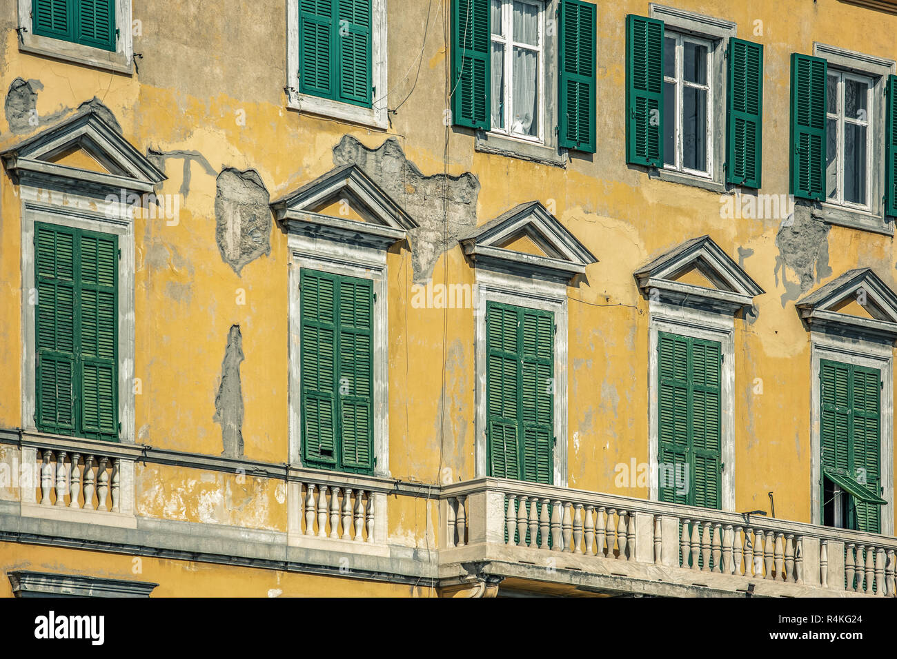 GENOVA,ITALY-12 OCTOBER,2018: Ancient Italian house painted in yellow ...