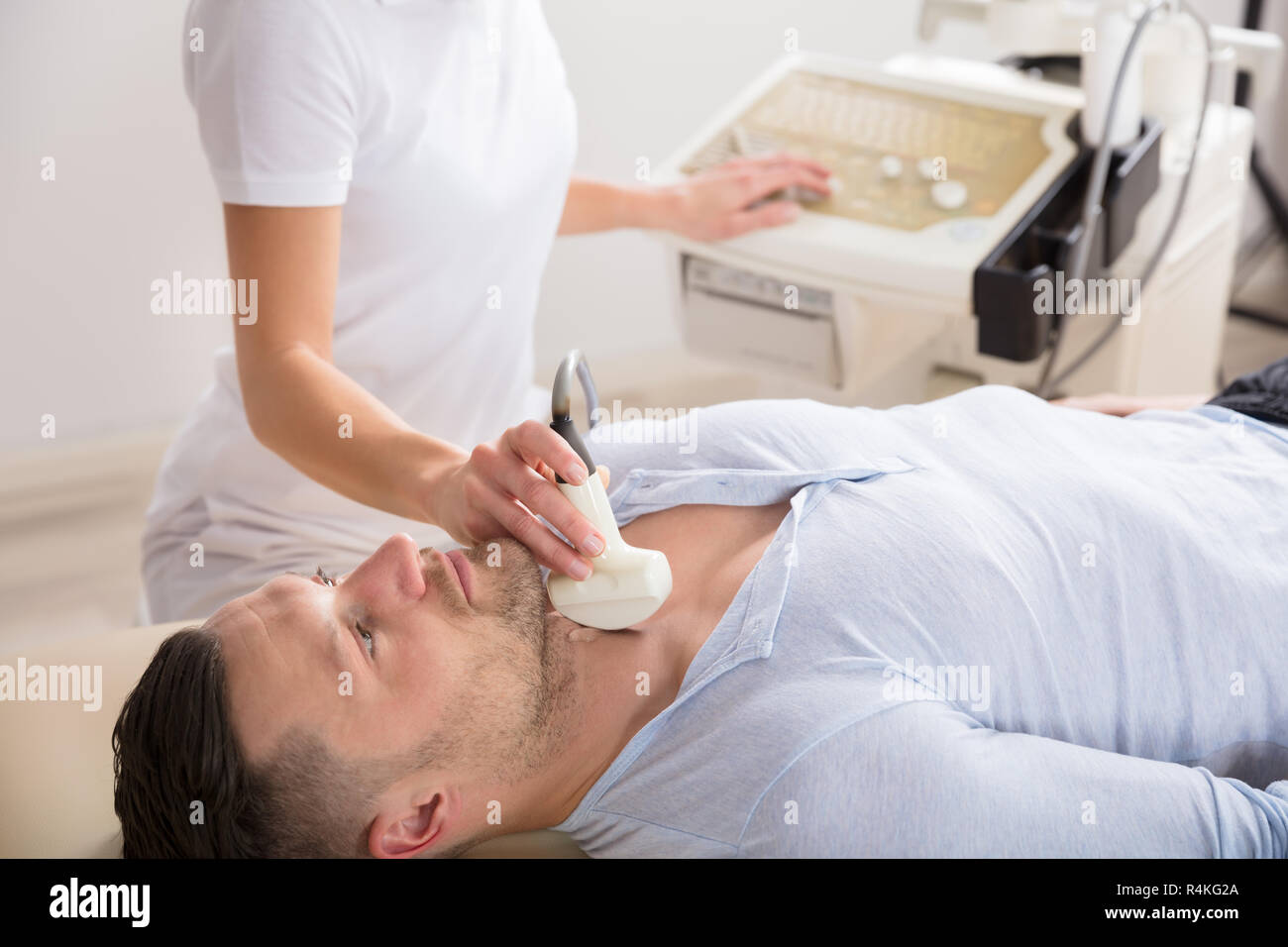 Nurse at the monitor with patient at ultrasound hi-res stock ...