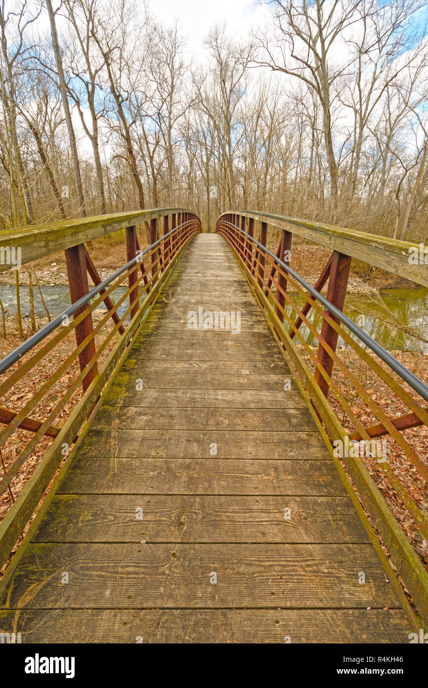 Footbridge over a Quiet River Stock Photo - Alamy