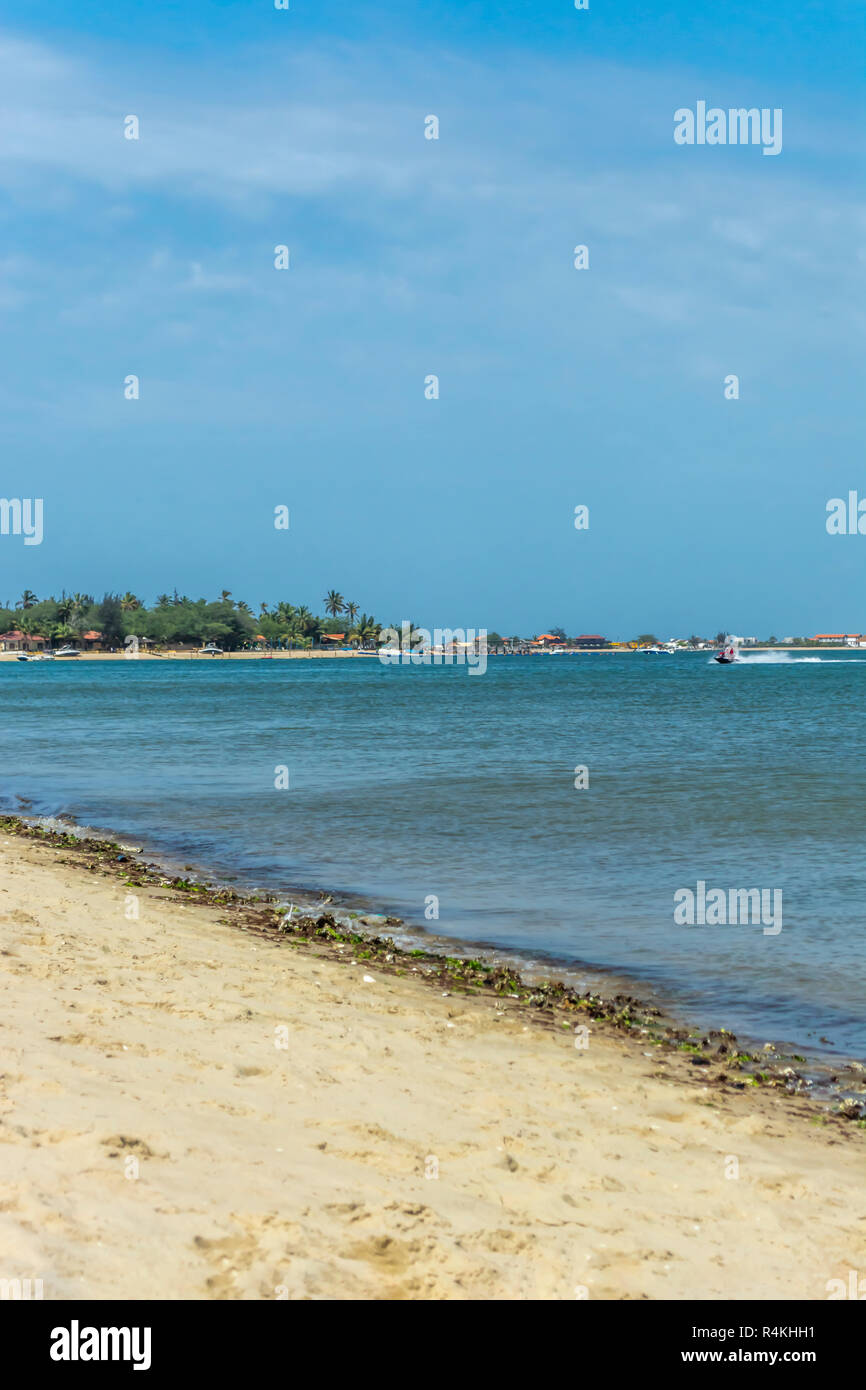 View at the beach and jet boat with people on water, on the Mussulo ...