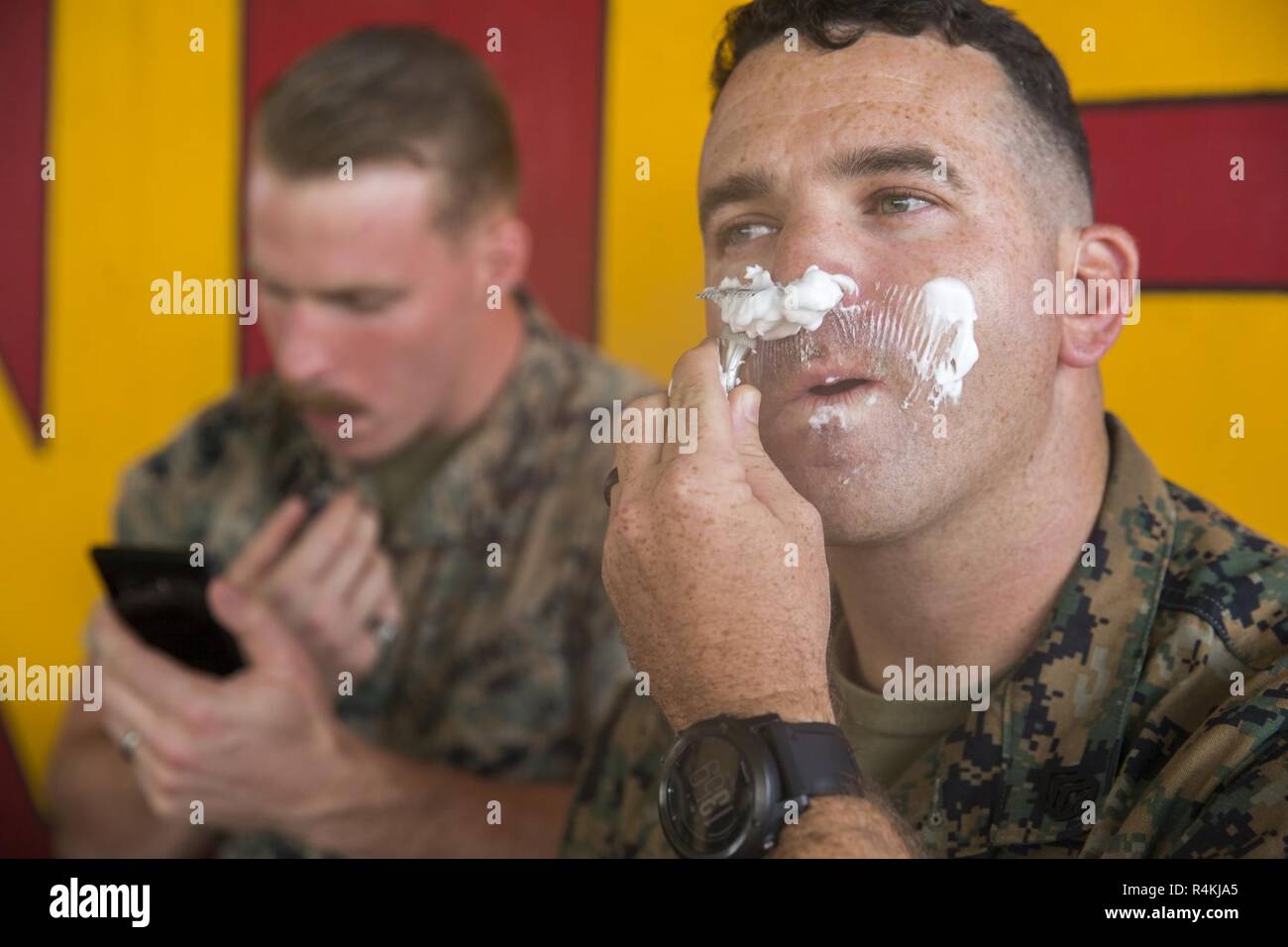 U.S. Marines with 3rd Marine Regiment, 3rd Marine Division shave off ...