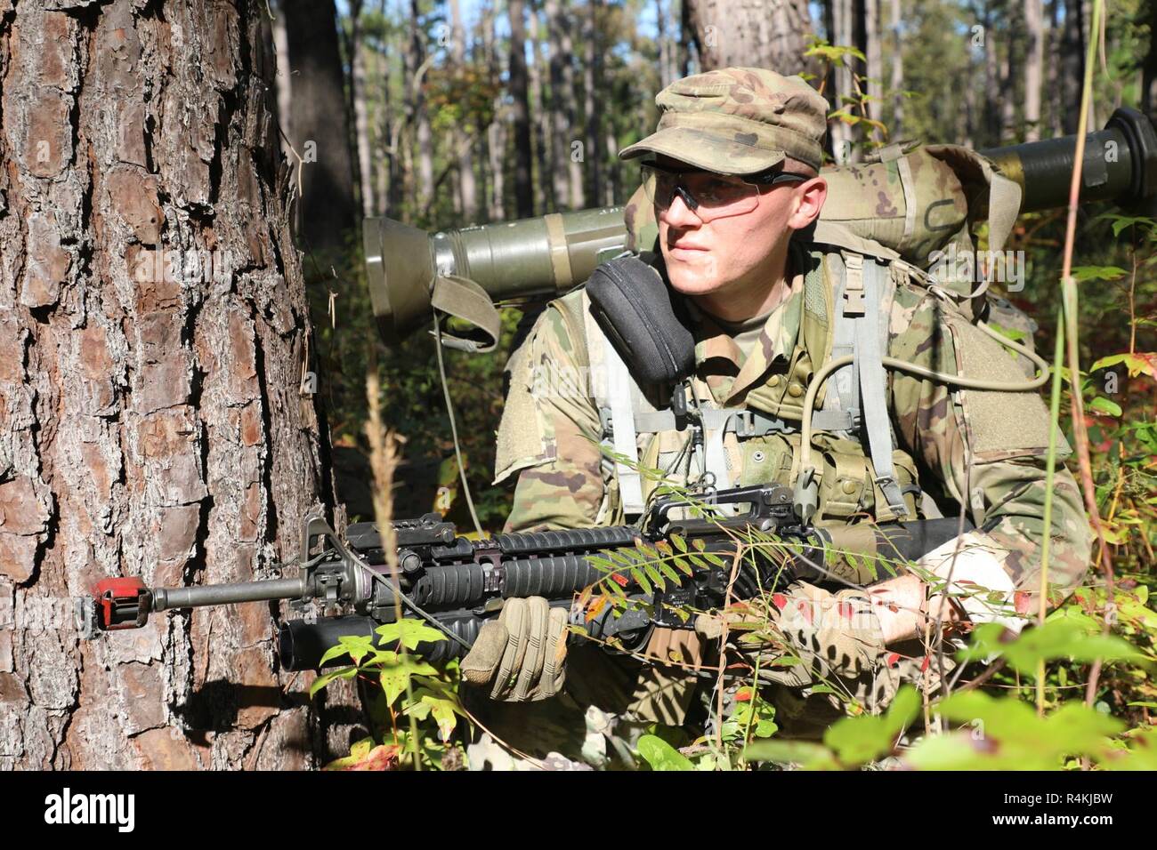 A U.S. Army Pre-Ranger Student, pulls security with his M-16A4/203 ...
