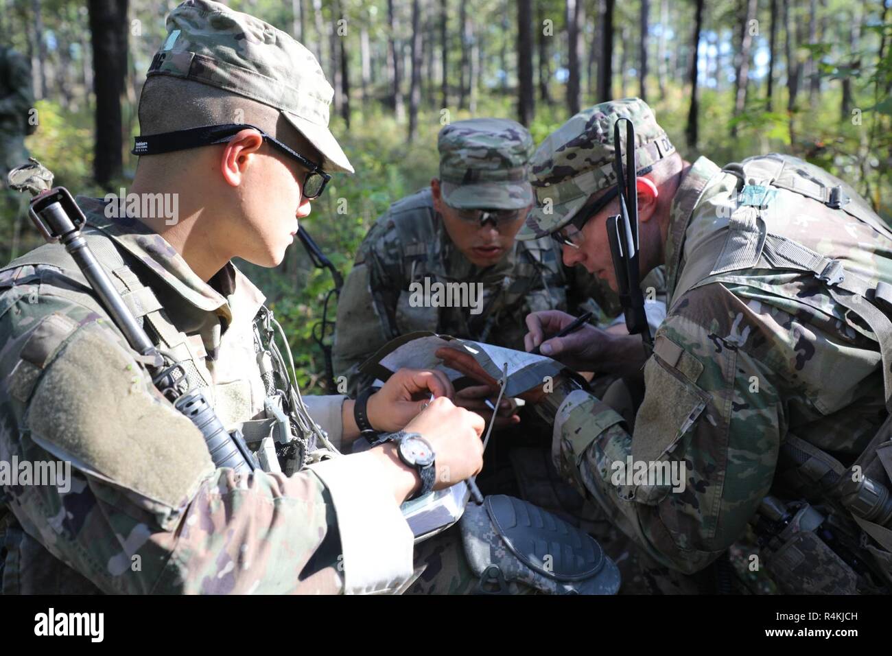 A group of U.S. Army Pre-Ranger Students, looks over the route to the ...