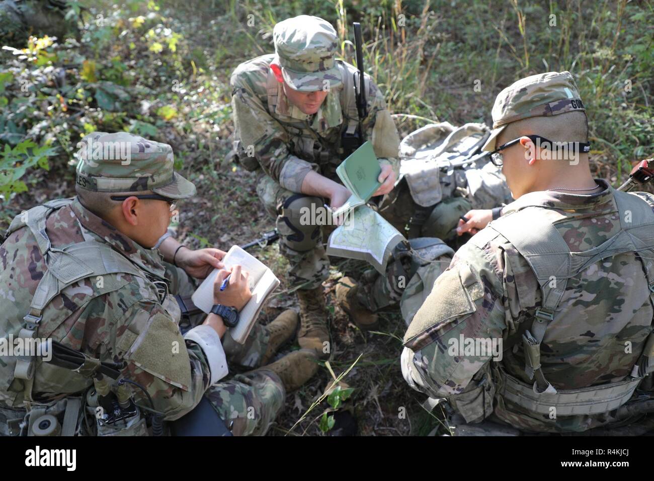 A group of U.S. Army Pre-Ranger Students, looks over the route to the ...
