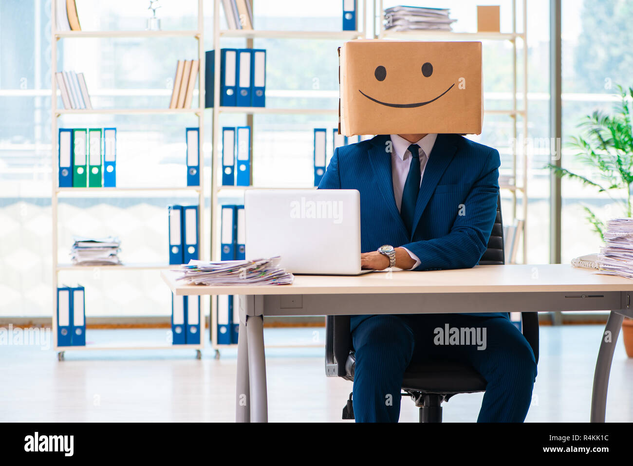 Happy man with box instead of his head Stock Photo - Alamy