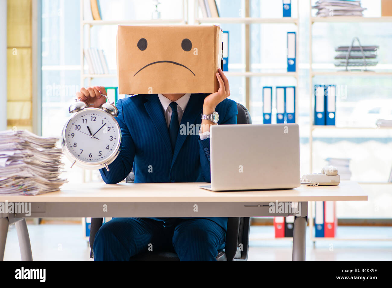 Unhappy man with box instead of his head Stock Photo - Alamy