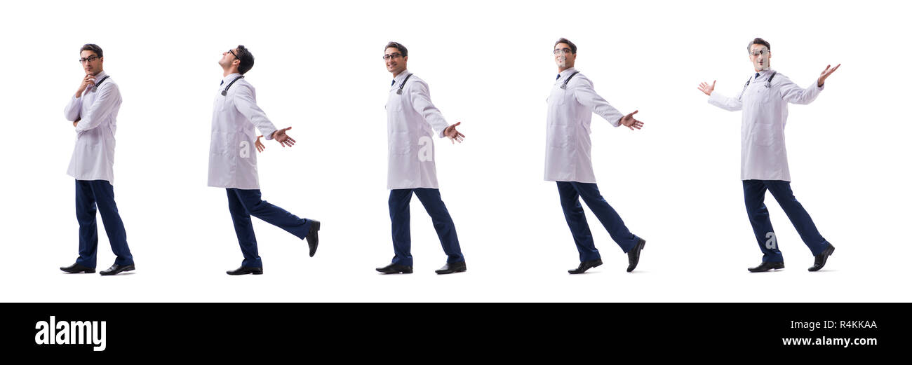 Young doctor physician standing walking isolated on white background ...