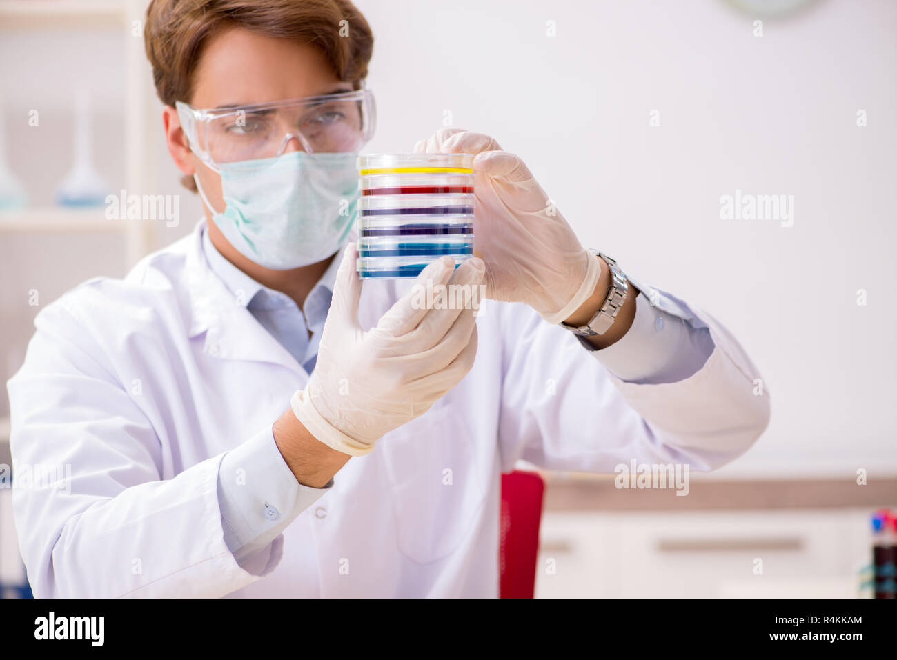 Young chemist working in the lab Stock Photo - Alamy
