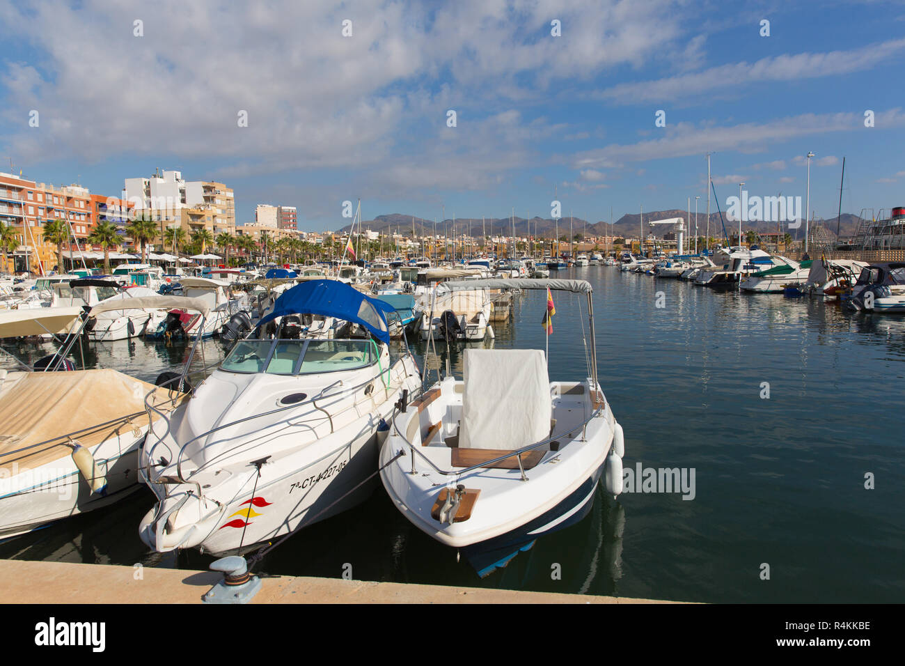 Puerto de Mazarron with boats and yachts in the harbour and blue sky ...