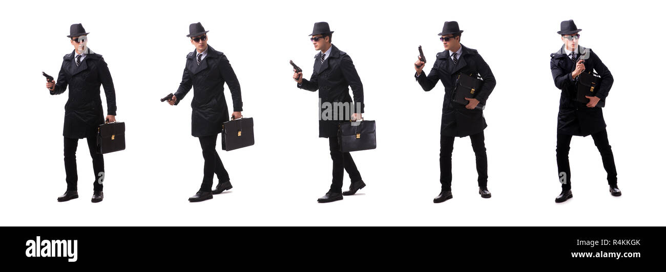 Man spy with handgun isolated on white background Stock Photo - Alamy
