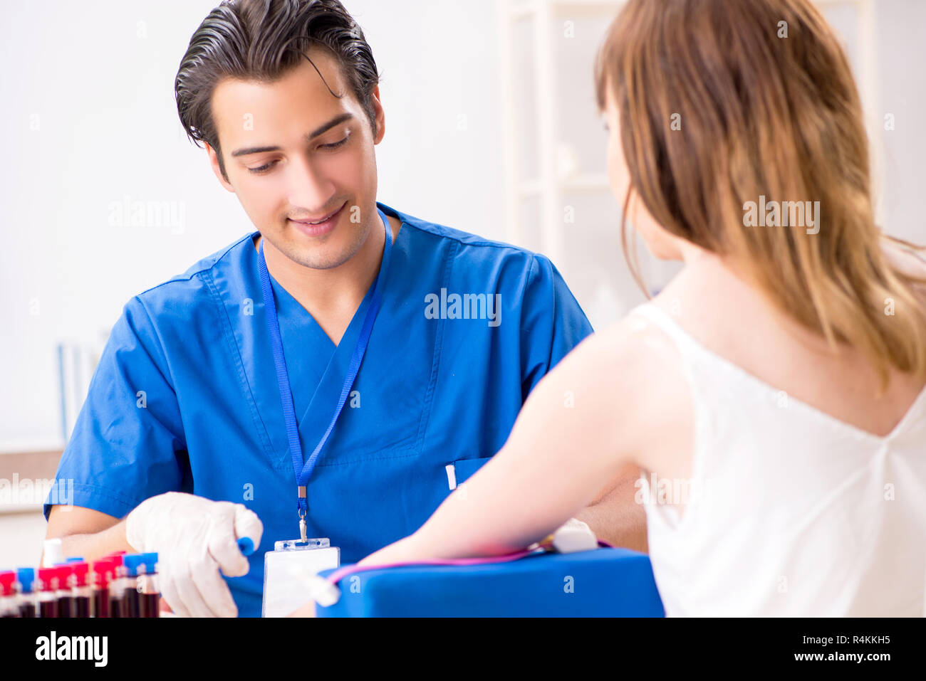 Young patient during blood test sampling procedure Stock Photo - Alamy