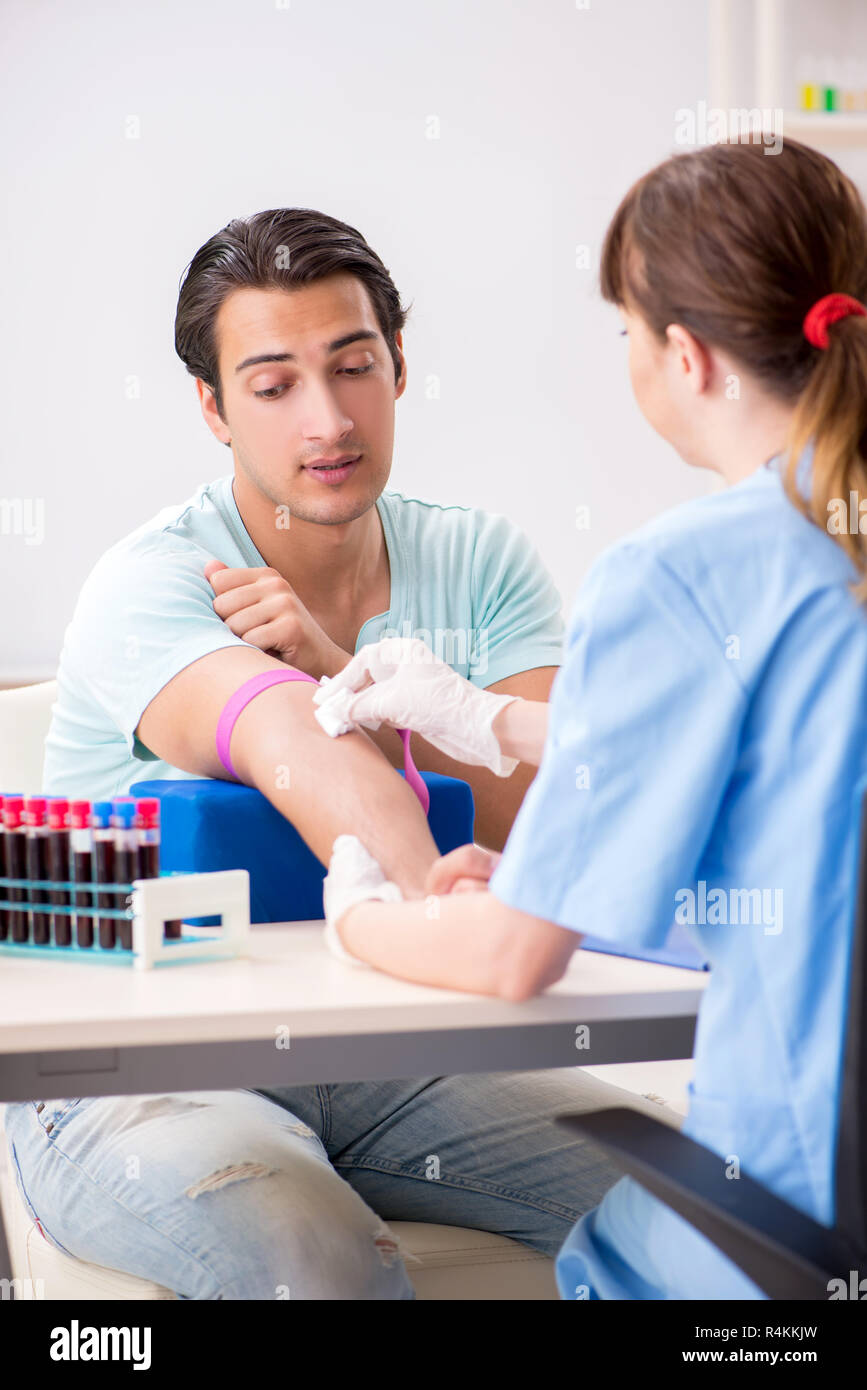 Young patient during blood test sampling procedure Stock Photo - Alamy