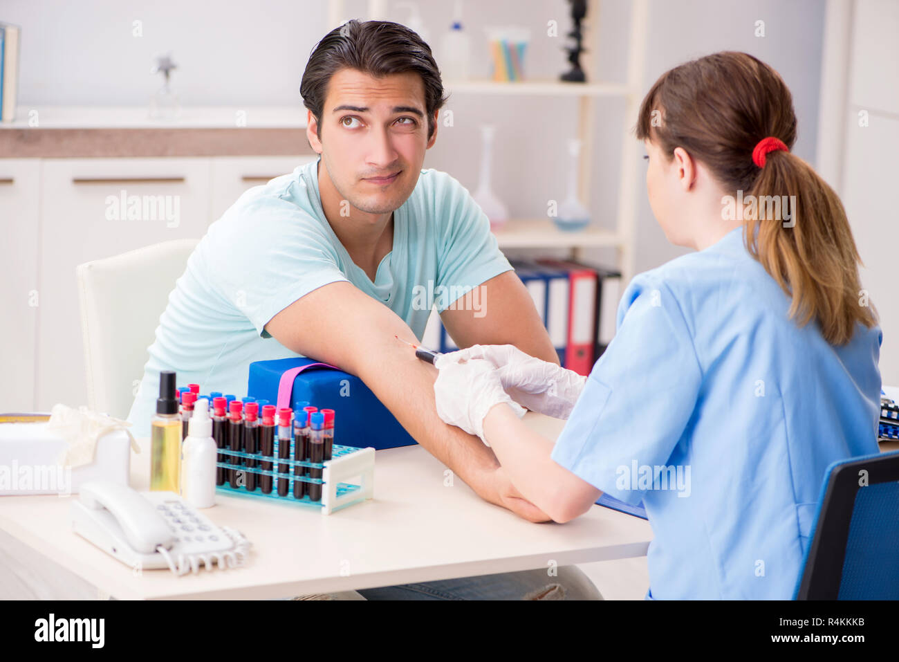 Young patient during blood test sampling procedure Stock Photo - Alamy
