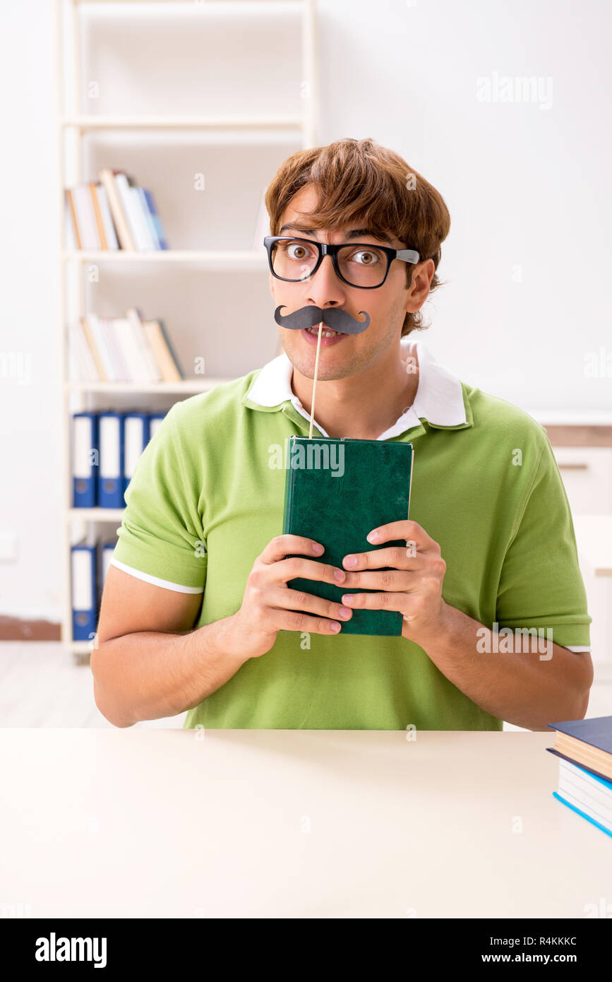 Student with fake moustache reading book Stock Photo - Alamy